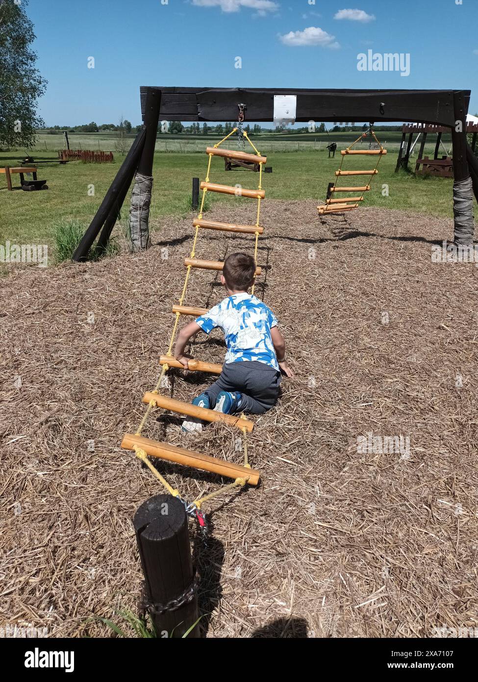 A child playing with a rope ladder Stock Photo - Alamy