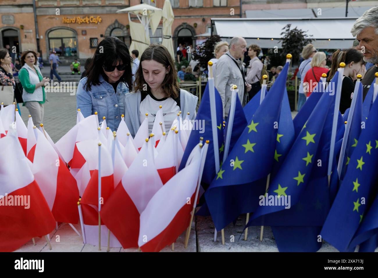 Polish and European Union flags are sold in the square before the start ...