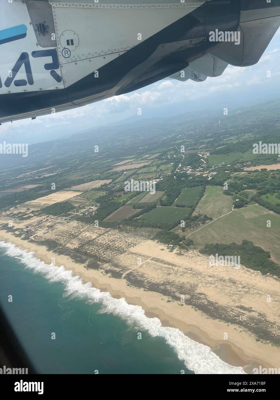 Plane flying over the Caribbean beaches in Puerto Escondido Oaxaca ...