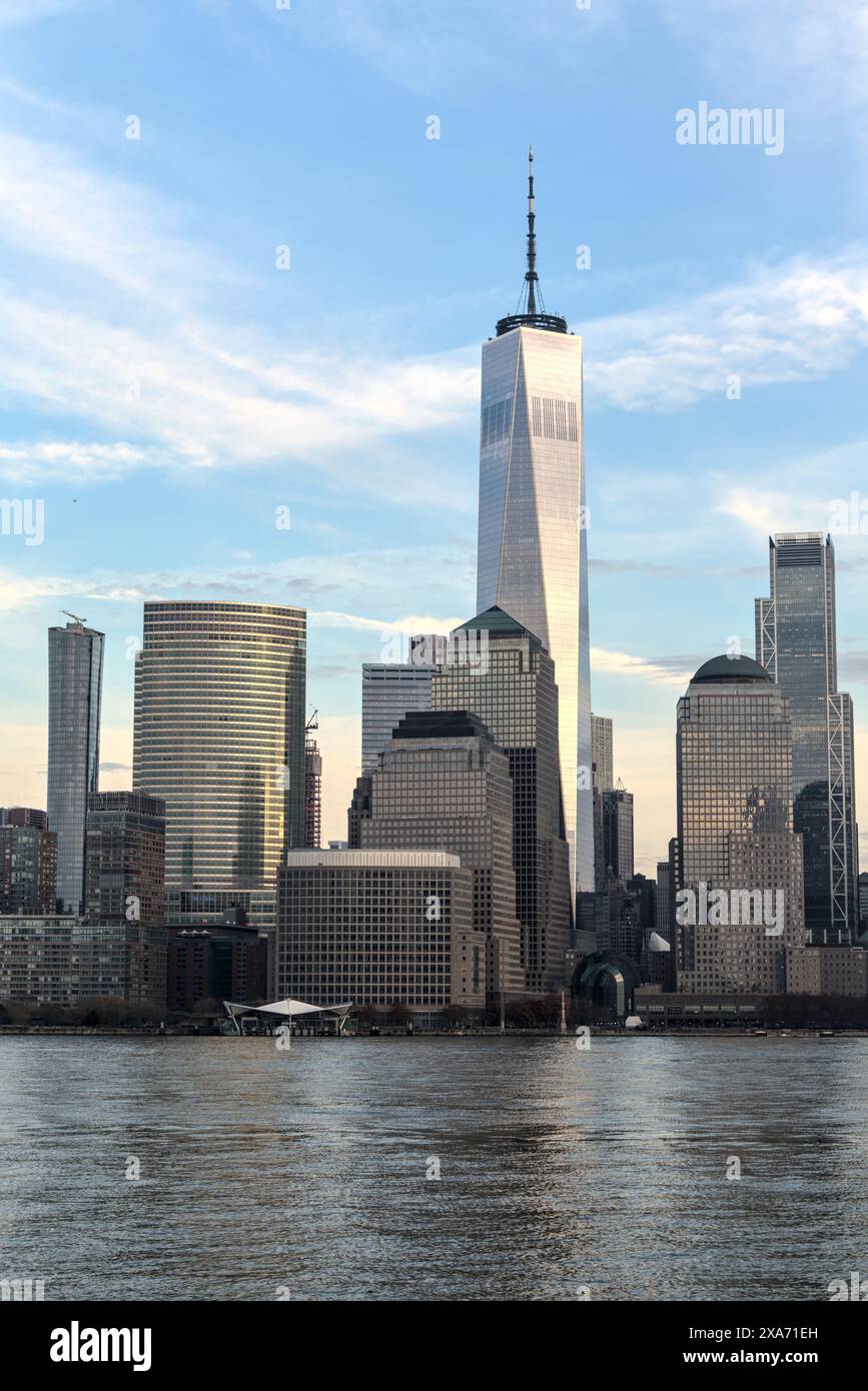 wooden bench on rooftop leading to view of downtown nyc (one world trade center freedom tower ...