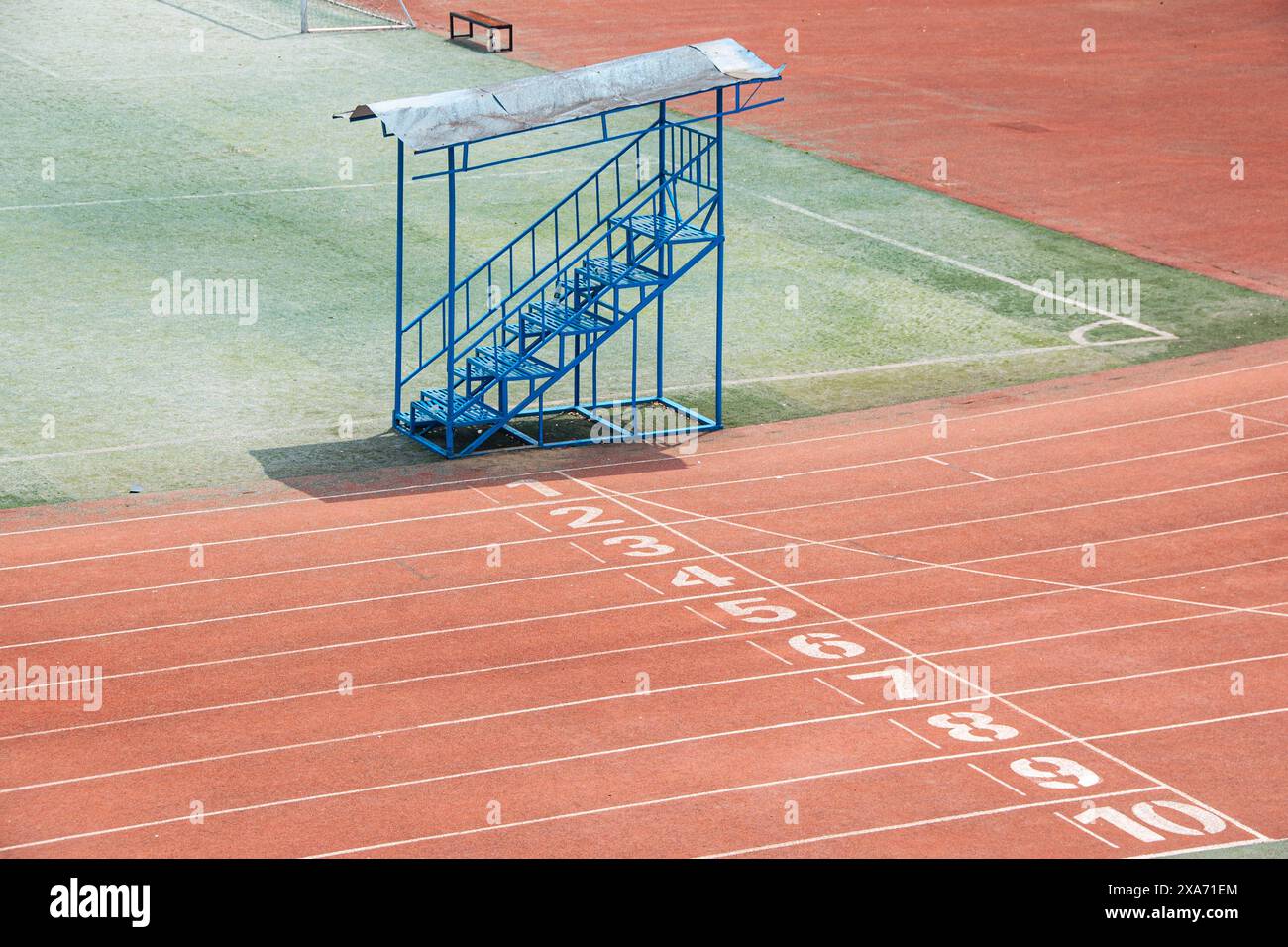 Stairway atop a red race track background Stock Photo - Alamy