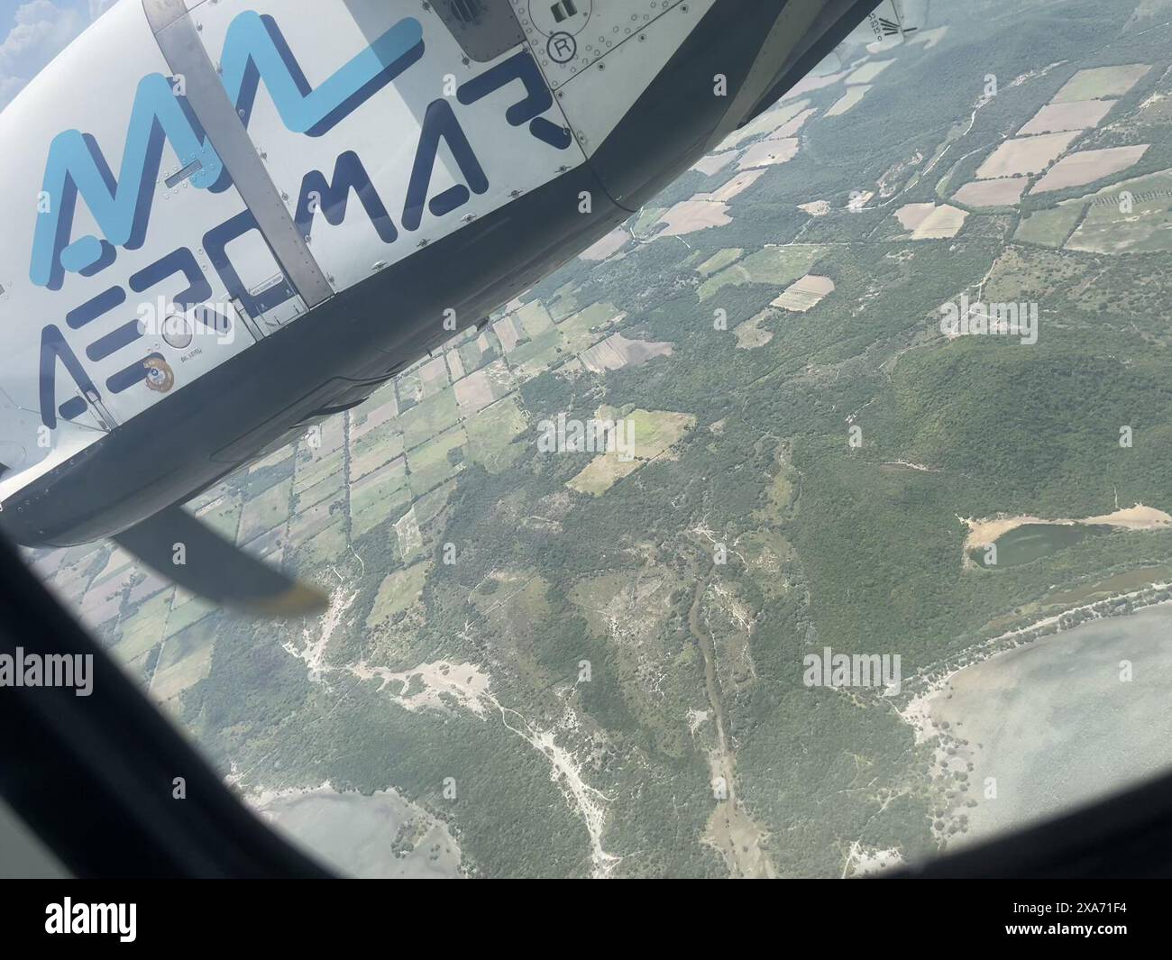 Plane flying over the Caribbean beaches in Puerto Escondido Oaxaca ...