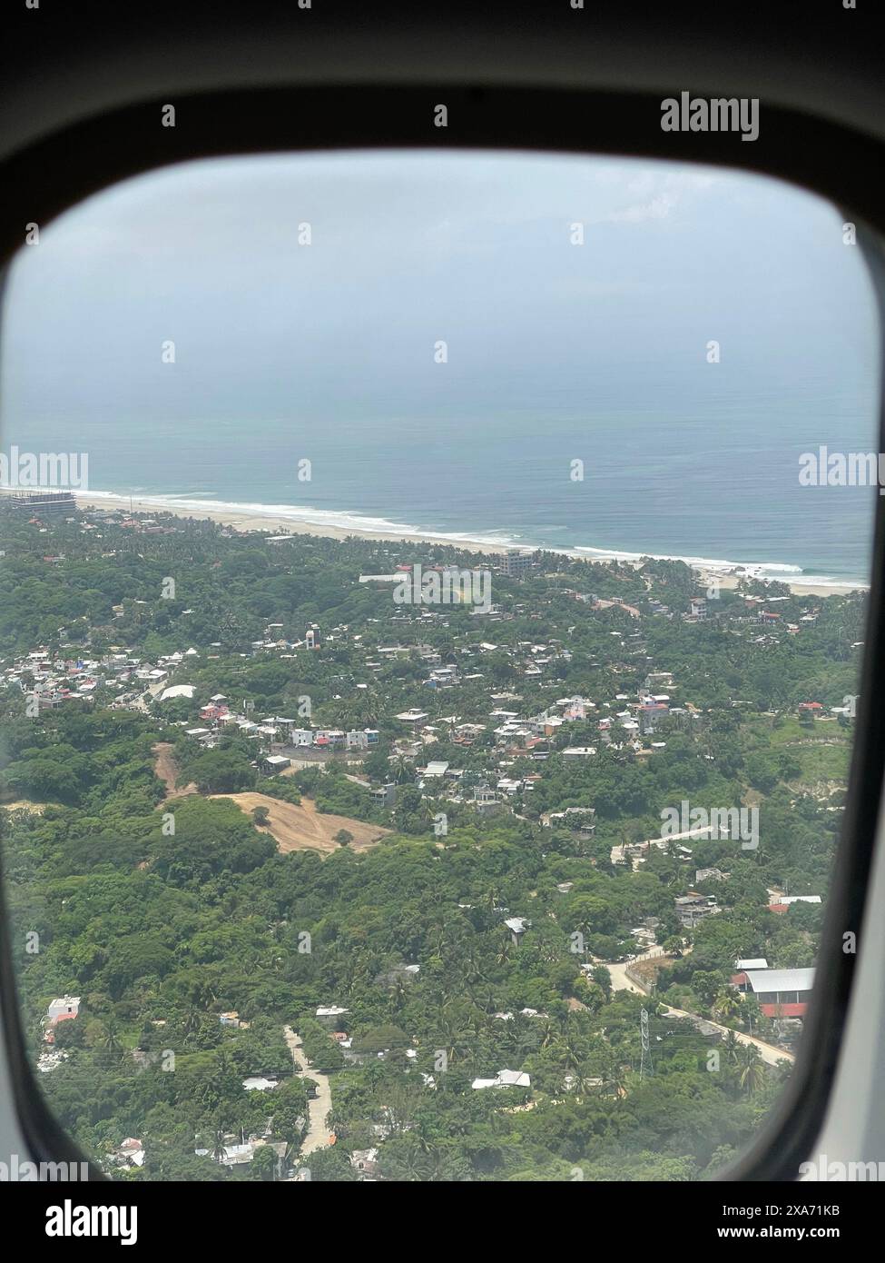 Plane flying over the Caribbean beaches in Puerto Escondido Oaxaca ...