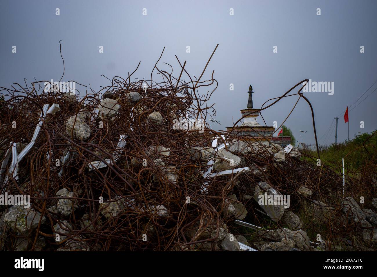 Rocks and barbed wire in front of a temple Stock Photo - Alamy