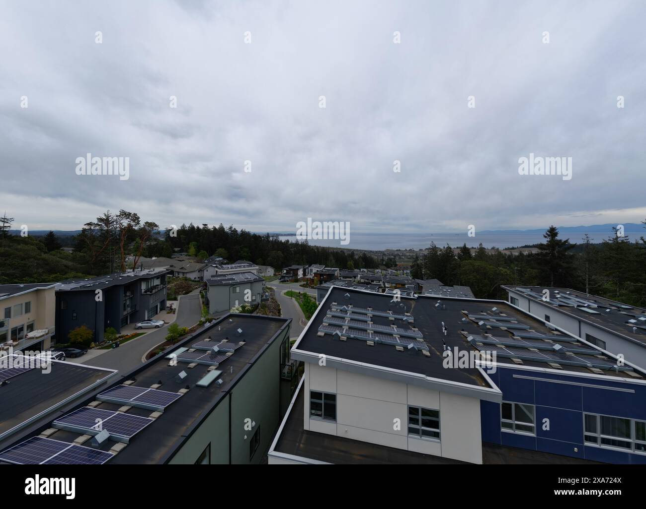 Multiple buildings with numerous solar panels on their rooftops Stock ...