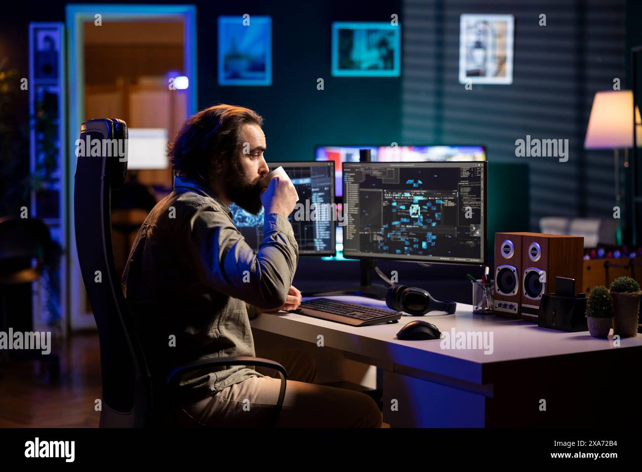 Software developer drinking coffee, watching AI on screen gaining ...