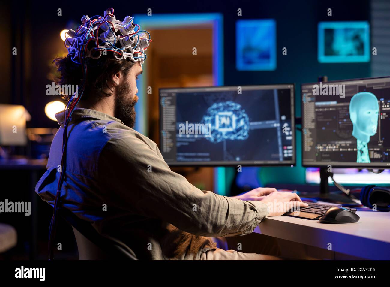 Developer with EEG headset on programming brain transfer into computer virtual world, becoming ...