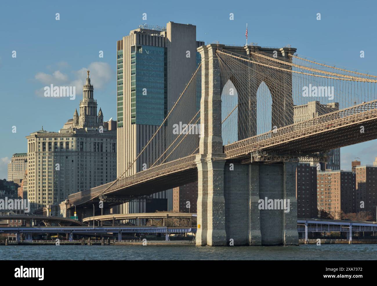 brooklyn bridge view over hudson river with nyc skyline background (urban cityscape of manhattan ...