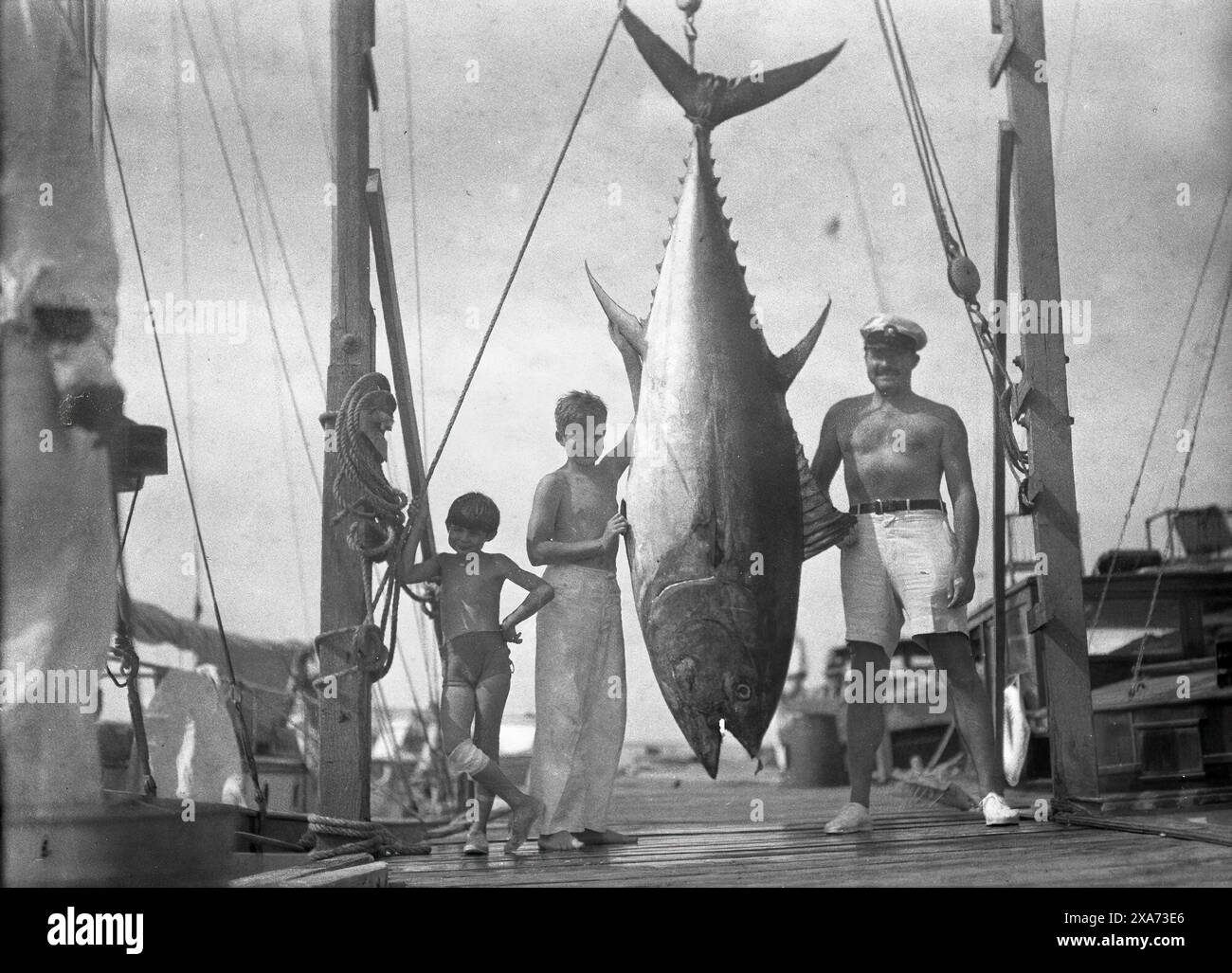 EH1614N ca. 1930's Ernest Hemingway on a dock with a tuna. Photograph ...