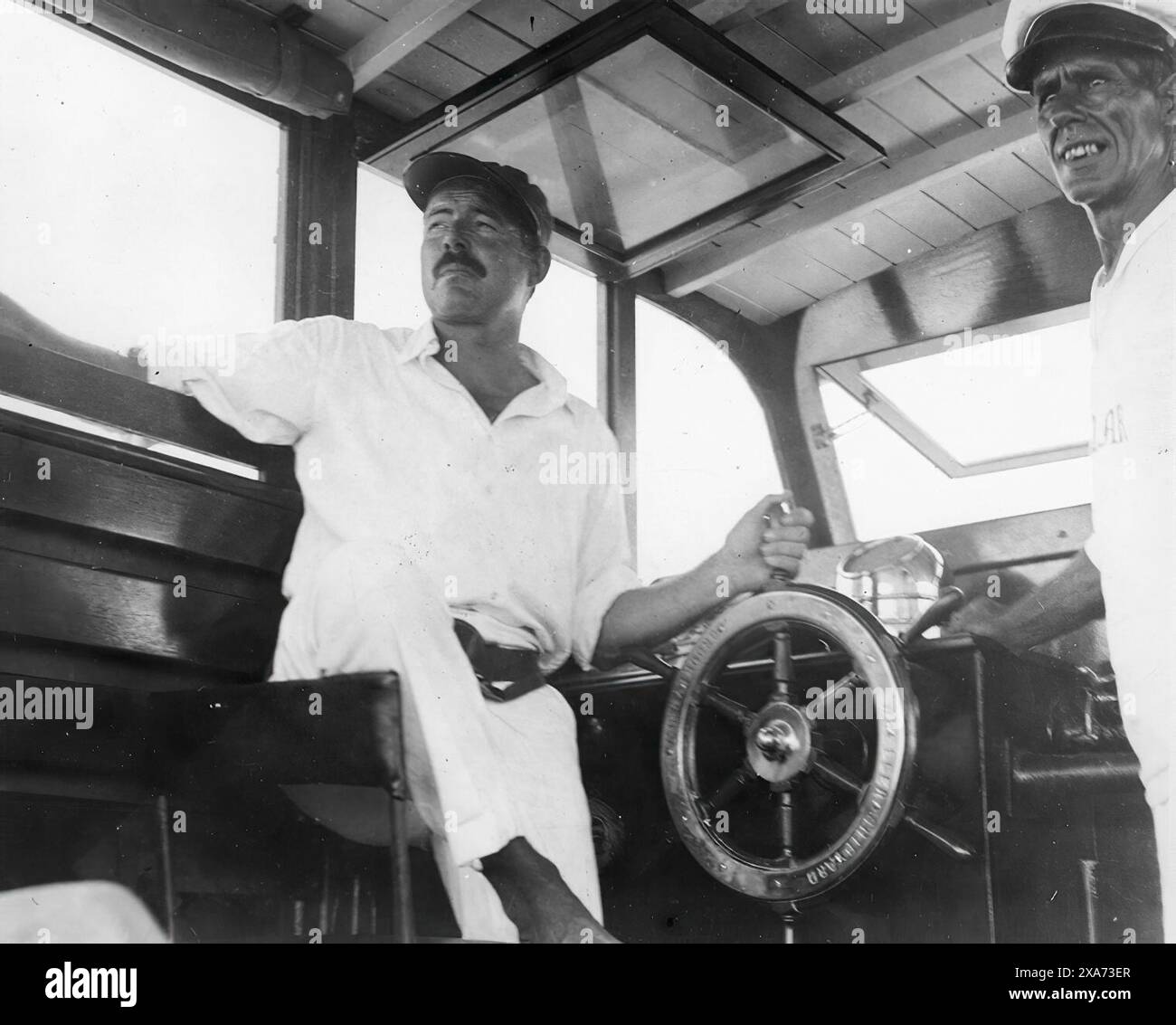 EH 8300P Ernest Hemingway and Carlos Gutierrez aboard Hemingway's boat ...