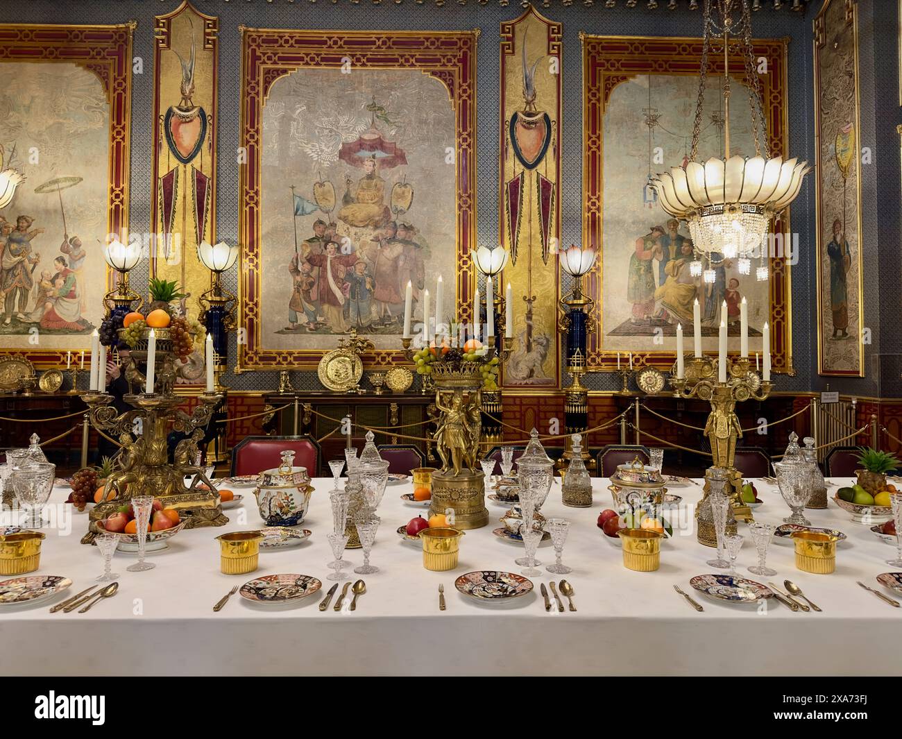 Elegantly set dining table with multiple plates Stock Photo - Alamy