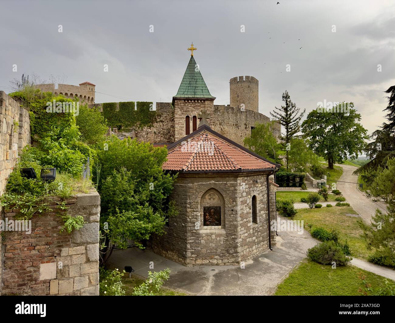 Stone building with twin towers side by side Stock Photo - Alamy
