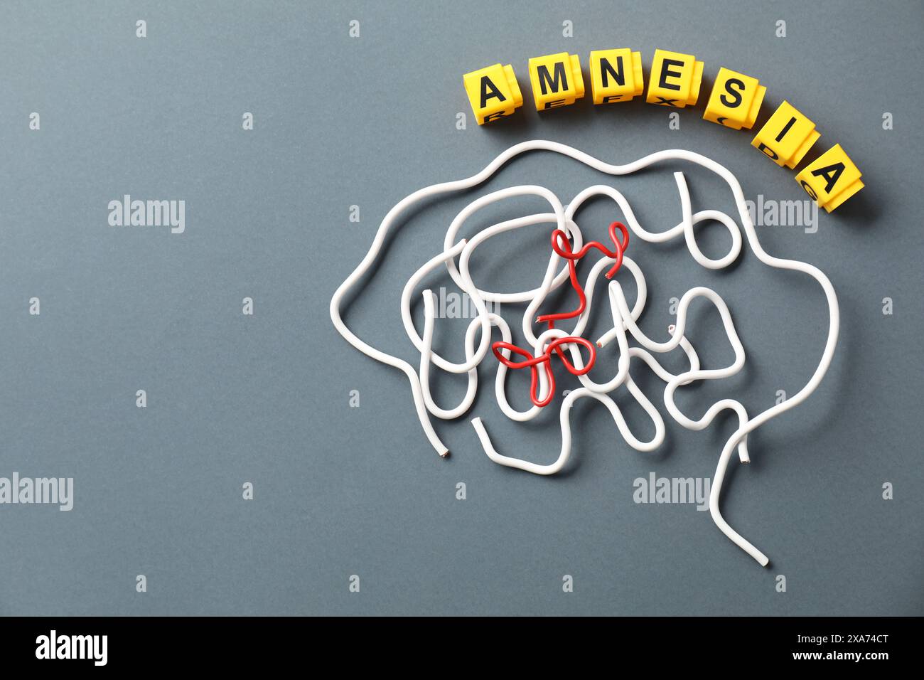 Word Amnesia and brain made of wires on grey background, flat lay ...