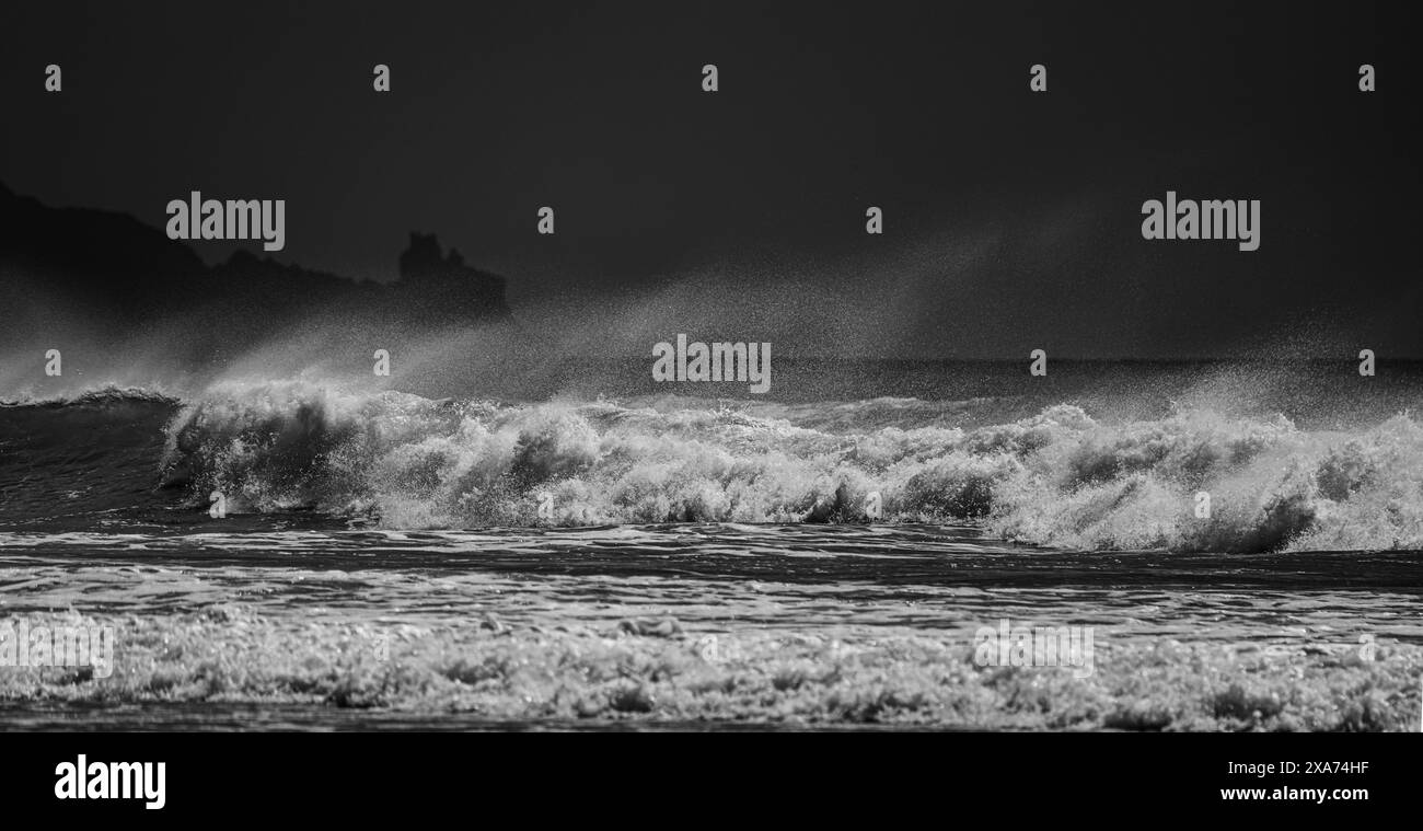 Black and white image of waves with wind blowing the top off them Stock ...