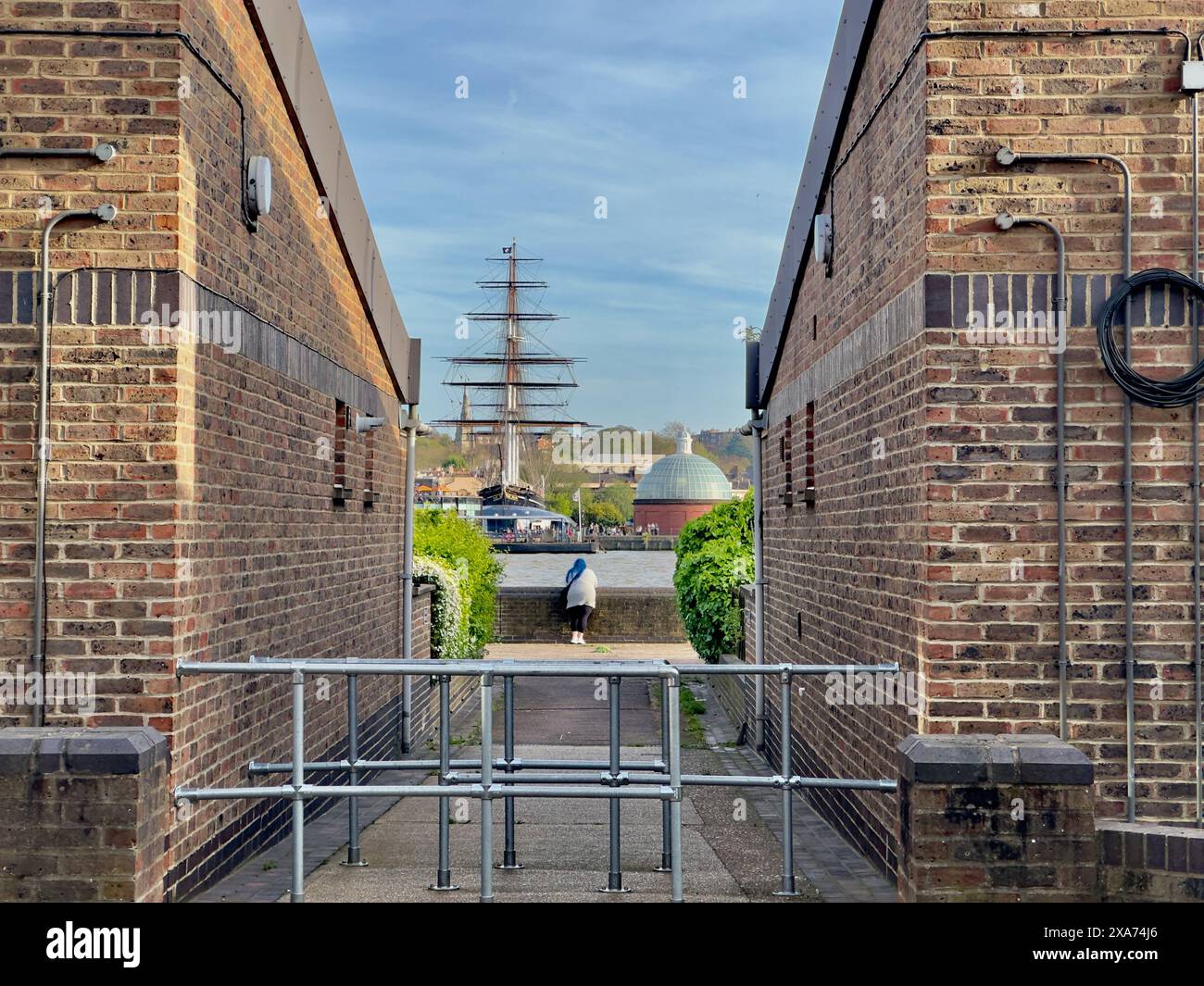A collection of gates positioned in front of a structure Stock Photo ...