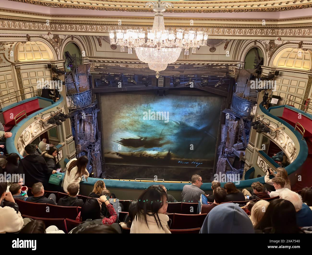 Audience at a cinema watching a big screen with viewers on it Stock ...