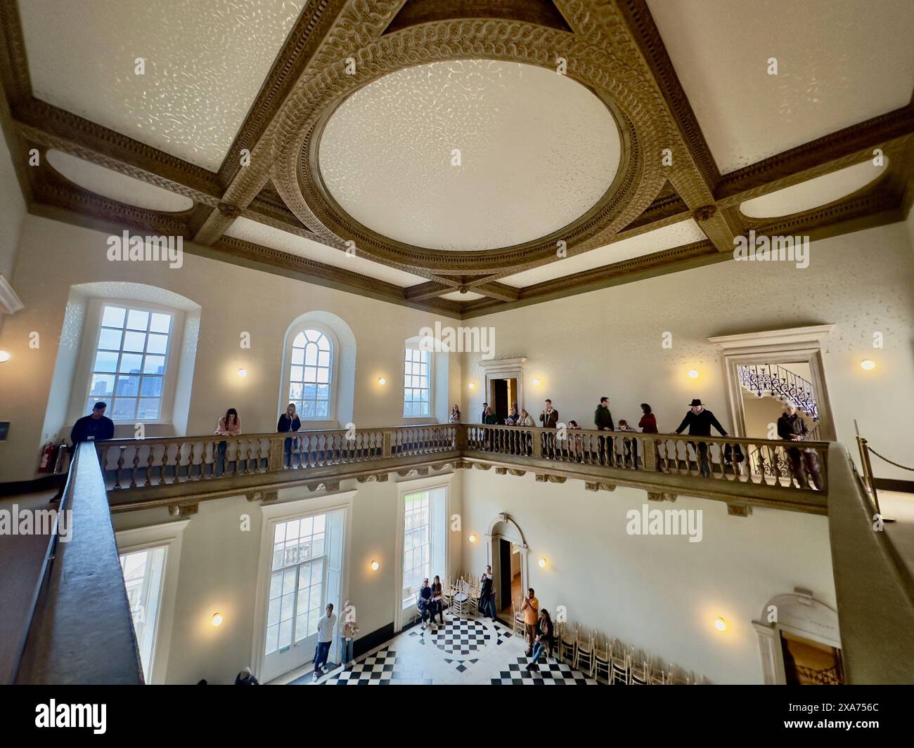 A Crowd gathered indoors at a museum Stock Photo - Alamy