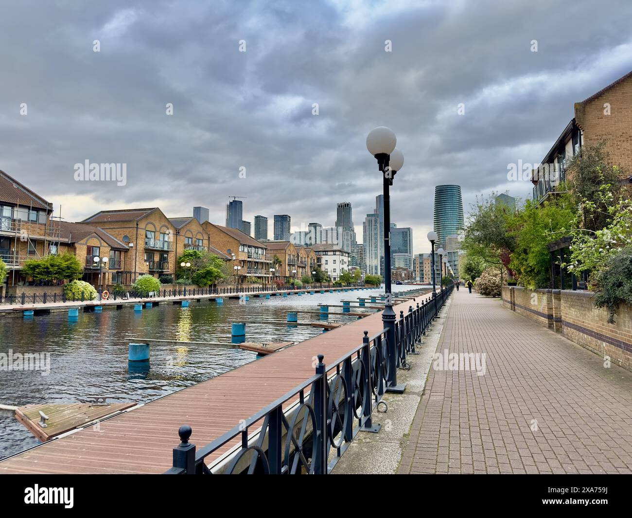 Crowded park with pedestrians strolling along the paths Stock Photo - Alamy