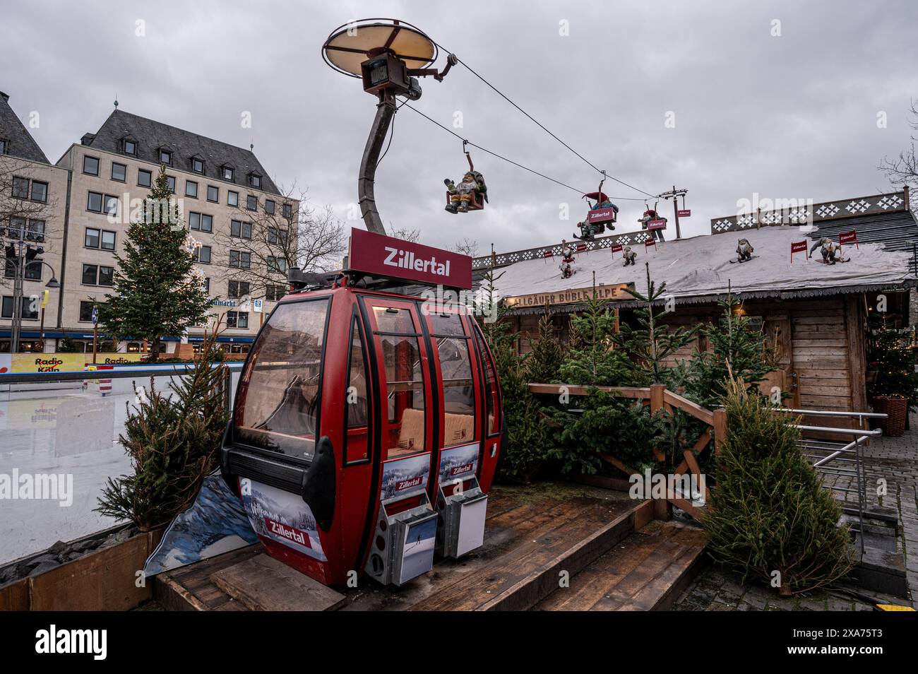 A cable car to transport passengers over a small outdoor ice rink in a ...