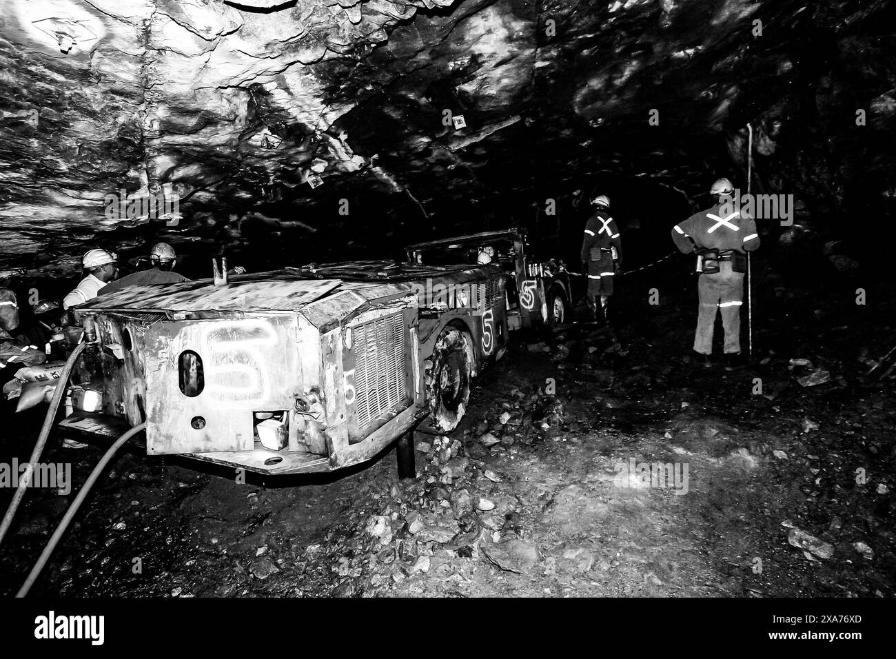 Monochrome image of coal miners working underground Stock Photo - Alamy