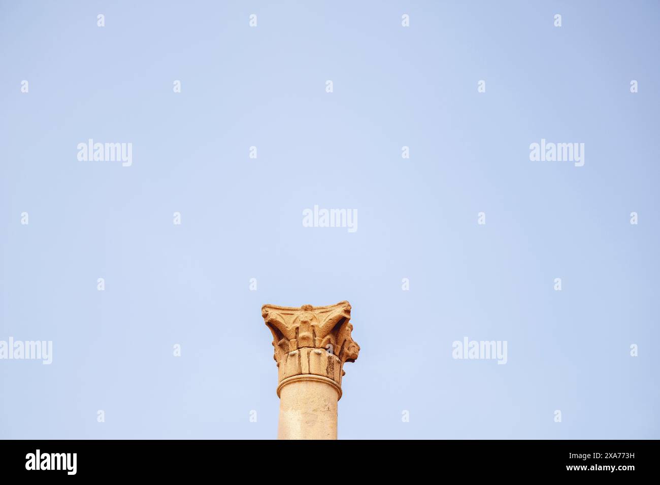 A circular structure with a pillar under a clear blue sky Stock Photo ...