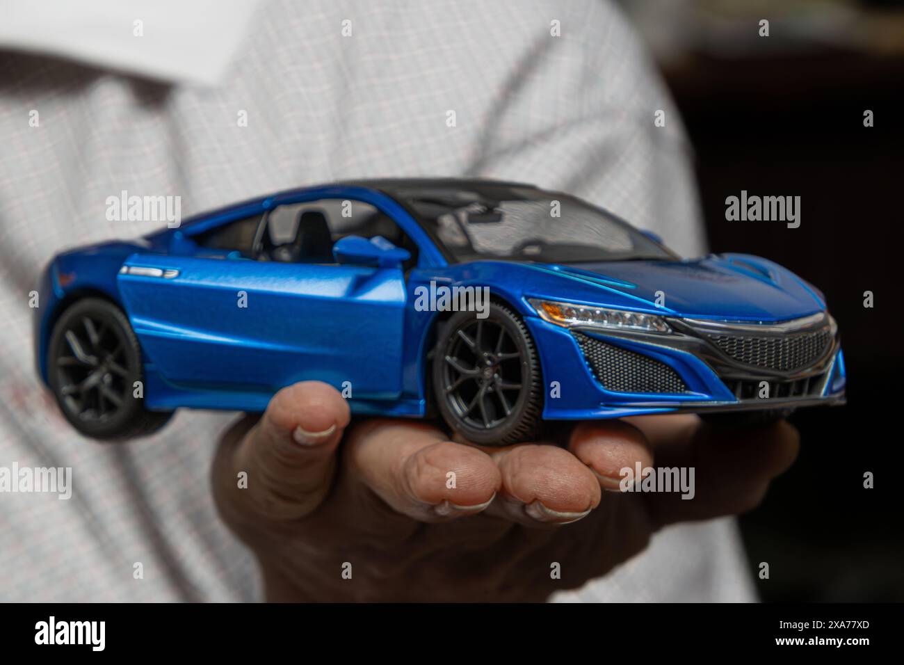 Blue toy car hi-res stock photography and images - Alamy