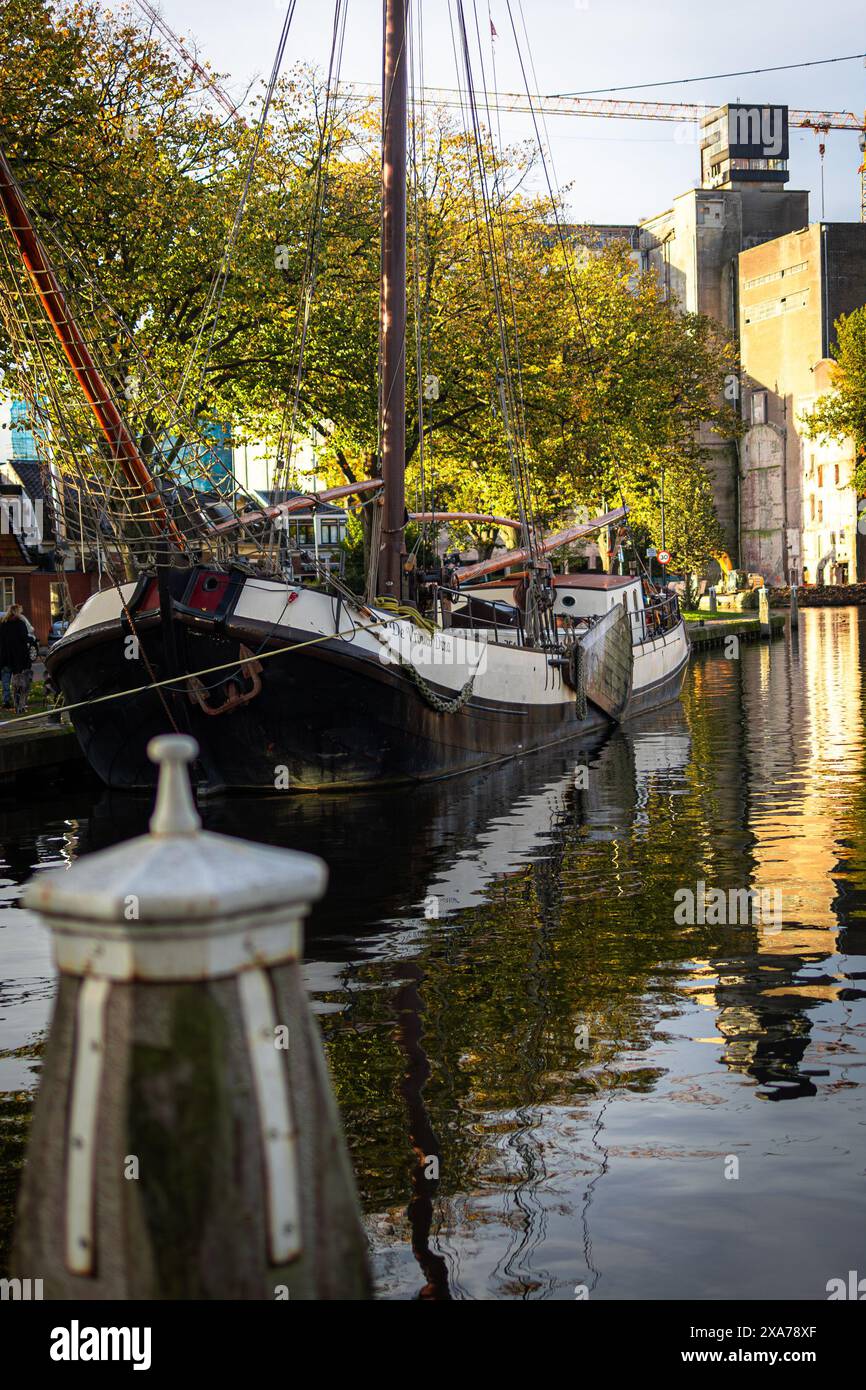 Boats floating in the harbor on calm waters Stock Photo - Alamy