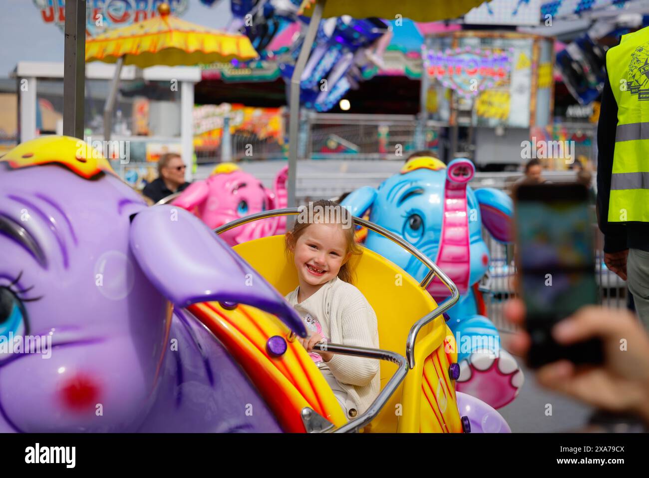 A child on fair ride, filmed on cell phone Stock Photo - Alamy