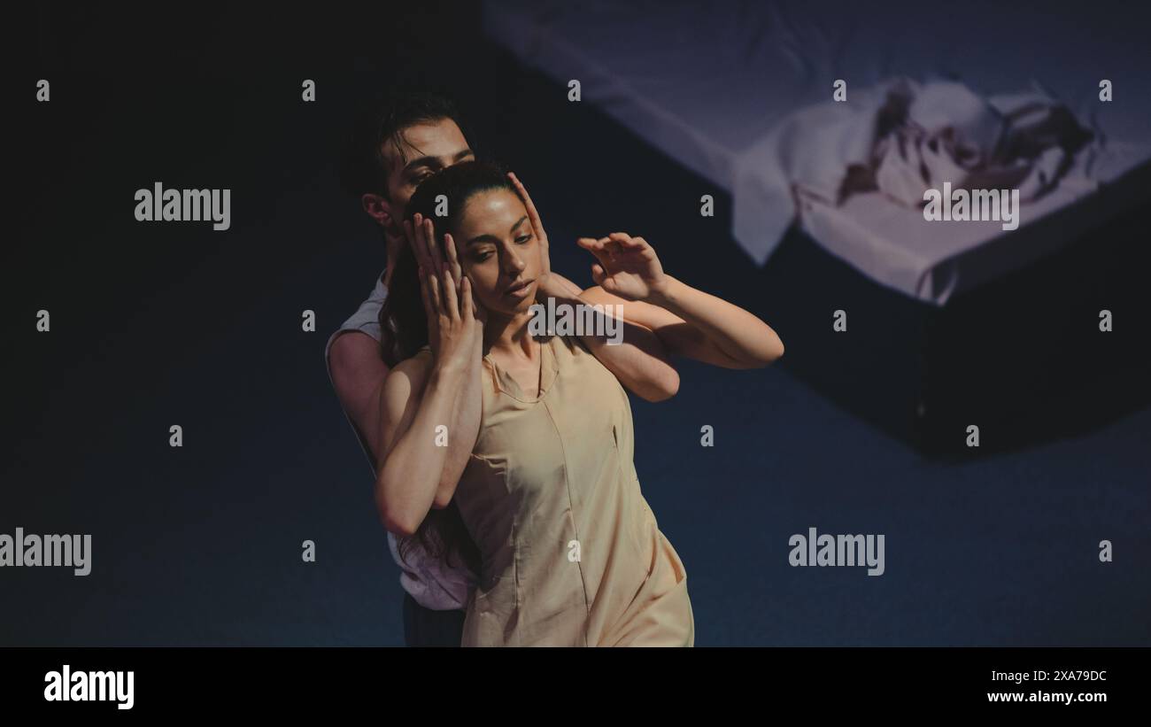 Two dancers on stage holding hands, one girl covering her face Stock ...