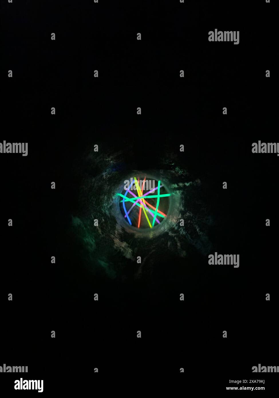 A colorful rainbow sphere among small bright orbs in darkness Stock ...