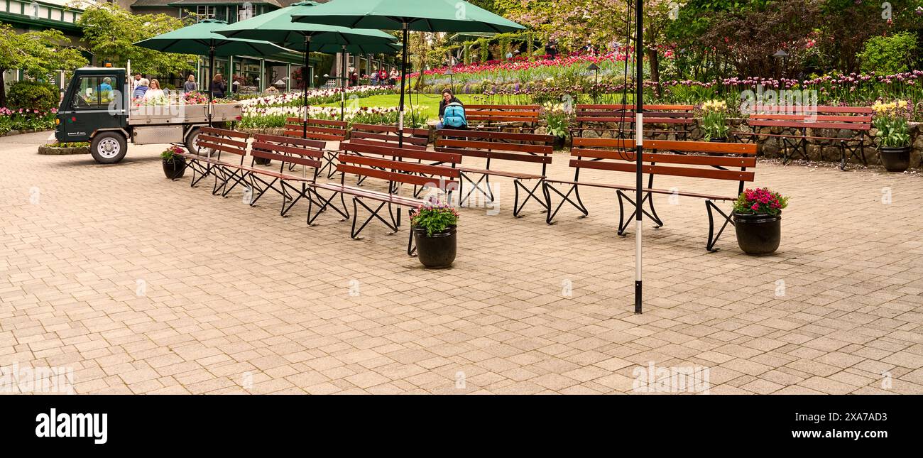 Rows of benches for tourists to sit on, a maintenance truck and ...