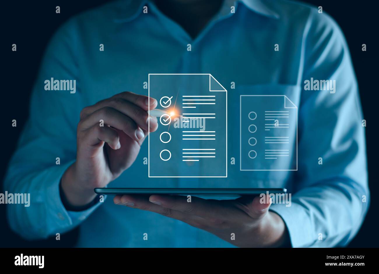 Businessman working with tablet. Checking mark up on the check boxes ...