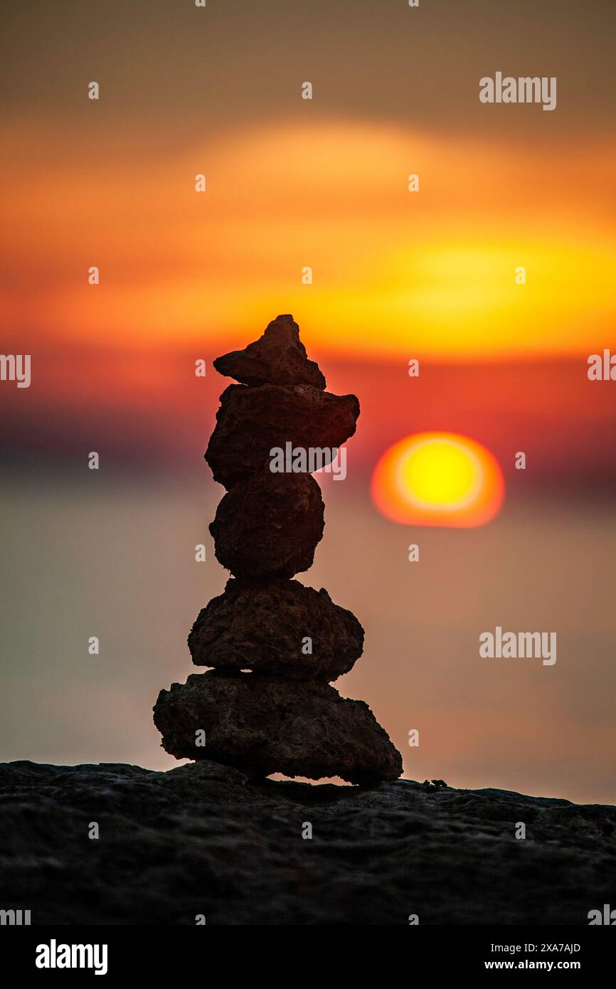 Stone sculpture by the sea at sunset Stock Photo - Alamy