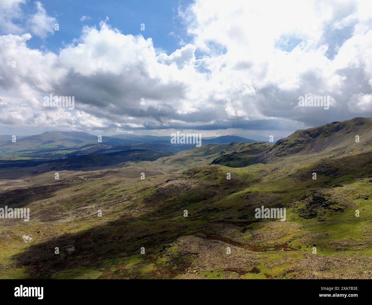 A beautiful landscape of rolling hills and valleys in Arenig Fawr ...