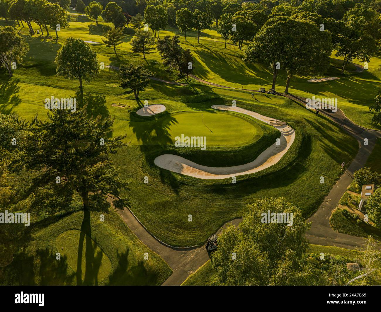 An aerial view of a beautifully landscaped golf course at the start of ...