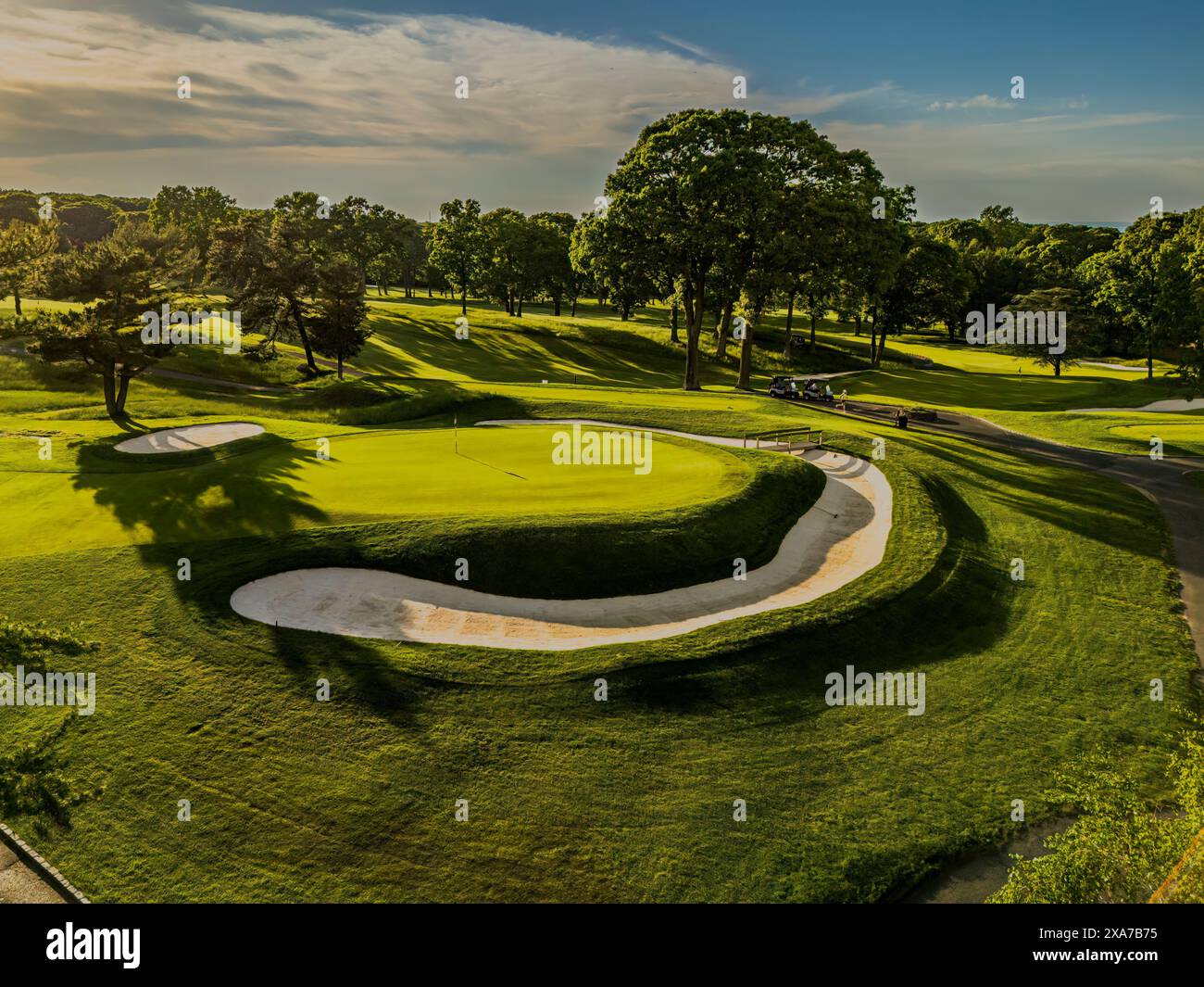 An aerial view of a beautifully landscaped golf course at the start of ...