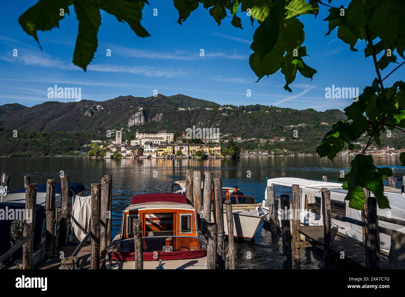 Water taxi in the foreground, view of Isola San Giulio from the port of ...
