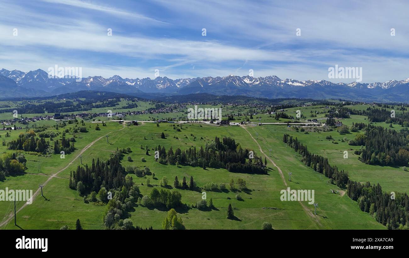 Aerial view of expansive valley encircled by mountains Stock Photo - Alamy