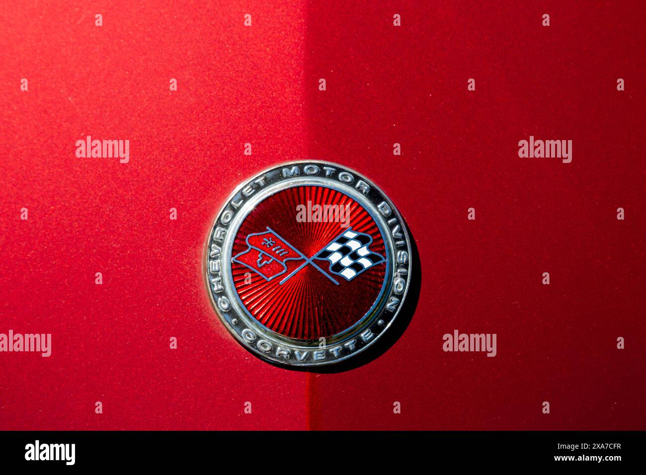 A Chevrolet Corvette emblem on a red C3 Vette Stock Photo - Alamy