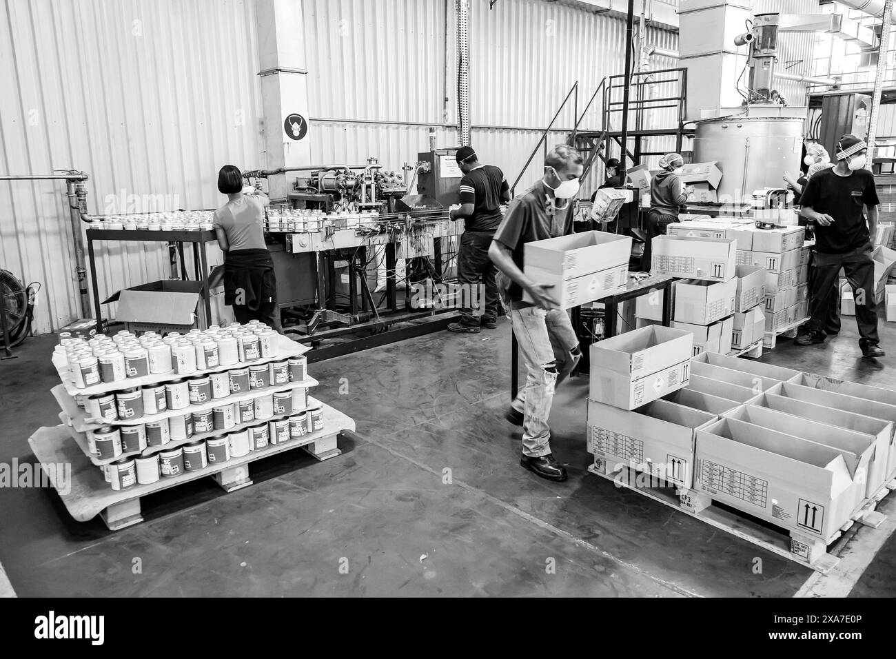 THe workers in a factory packing packages in Johannesburg, South Africa ...