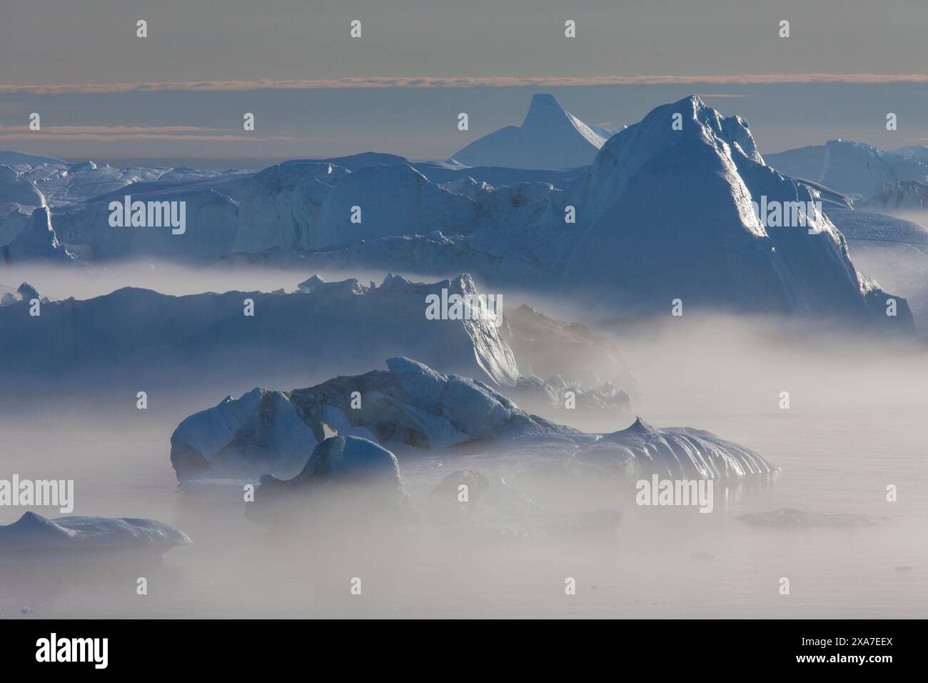 Iceberg in cold mist, Kangia Icefjord, UNESCO World Heritage Site ...