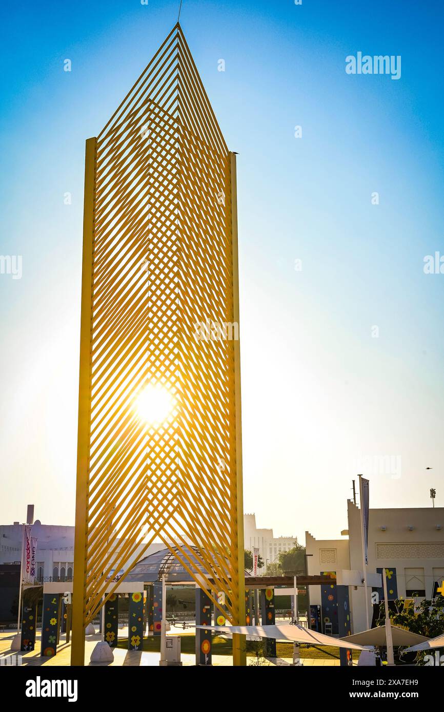 A tall golden structure amidst green grass Stock Photo - Alamy