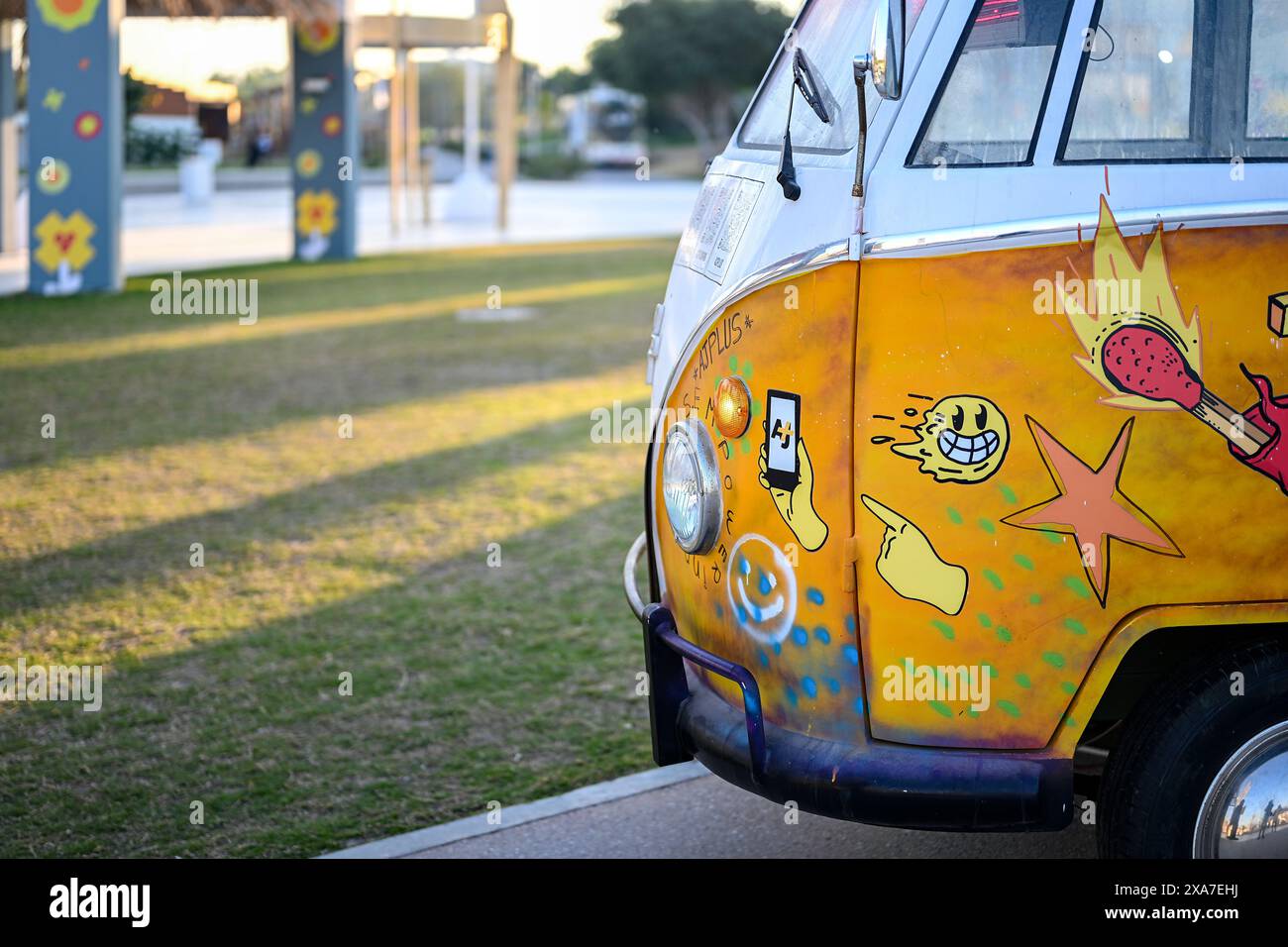 A colorful mini van parked on roadside Stock Photo - Alamy
