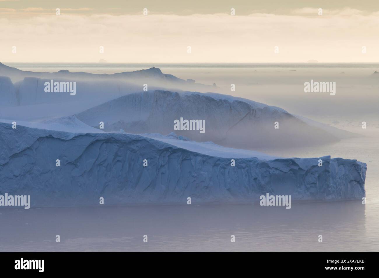 Iceberg in cold mist, Kangia Icefjord, UNESCO World Heritage Site ...