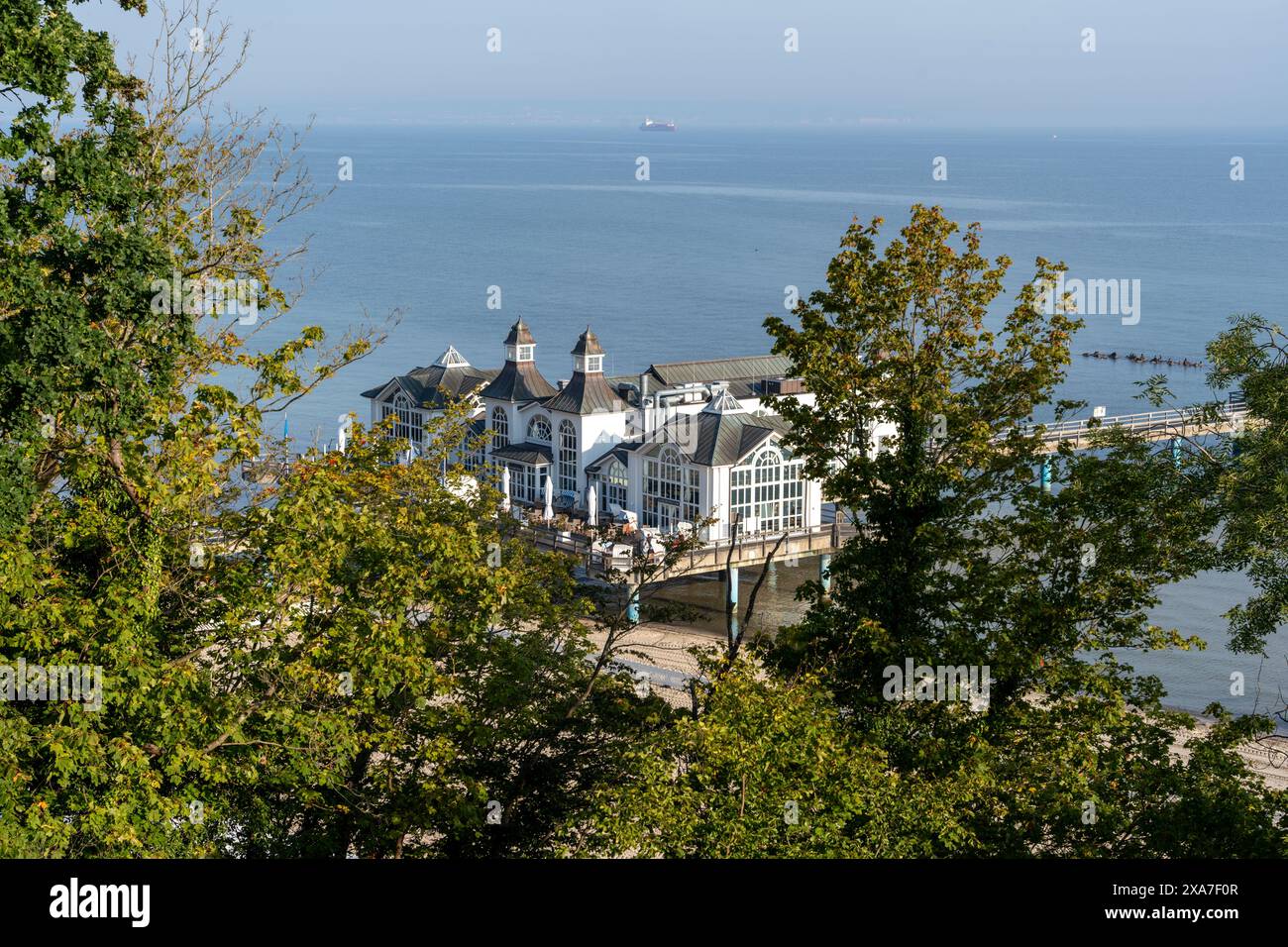 A large beachfront buildings complex captured from lush greenery view ...