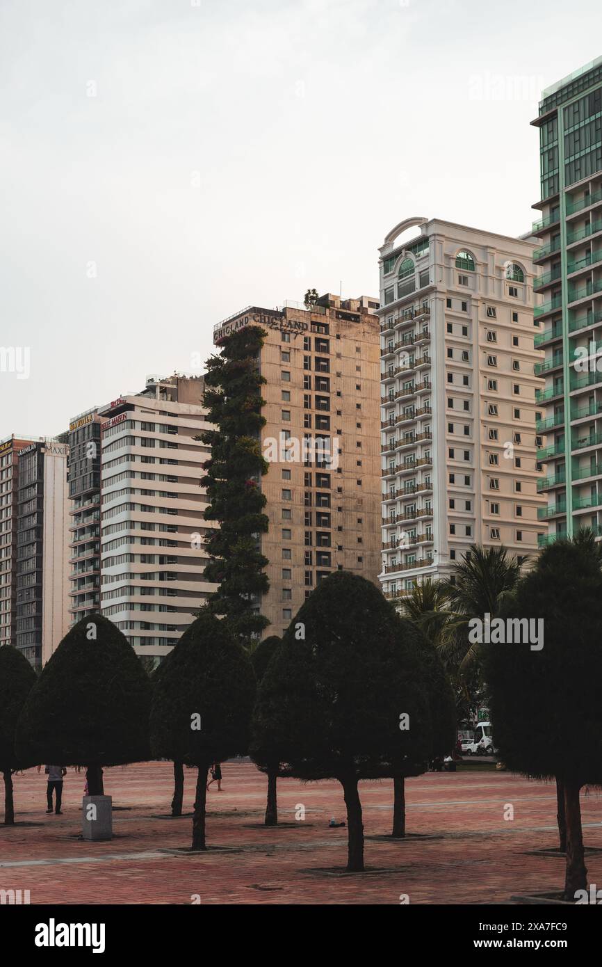 The high-rise apartments stand tall near trees, one designed for ...
