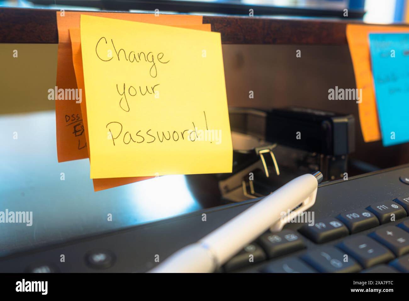 Sticky Note Reminder on Office Desk Saying "Change Your Password Stock ...