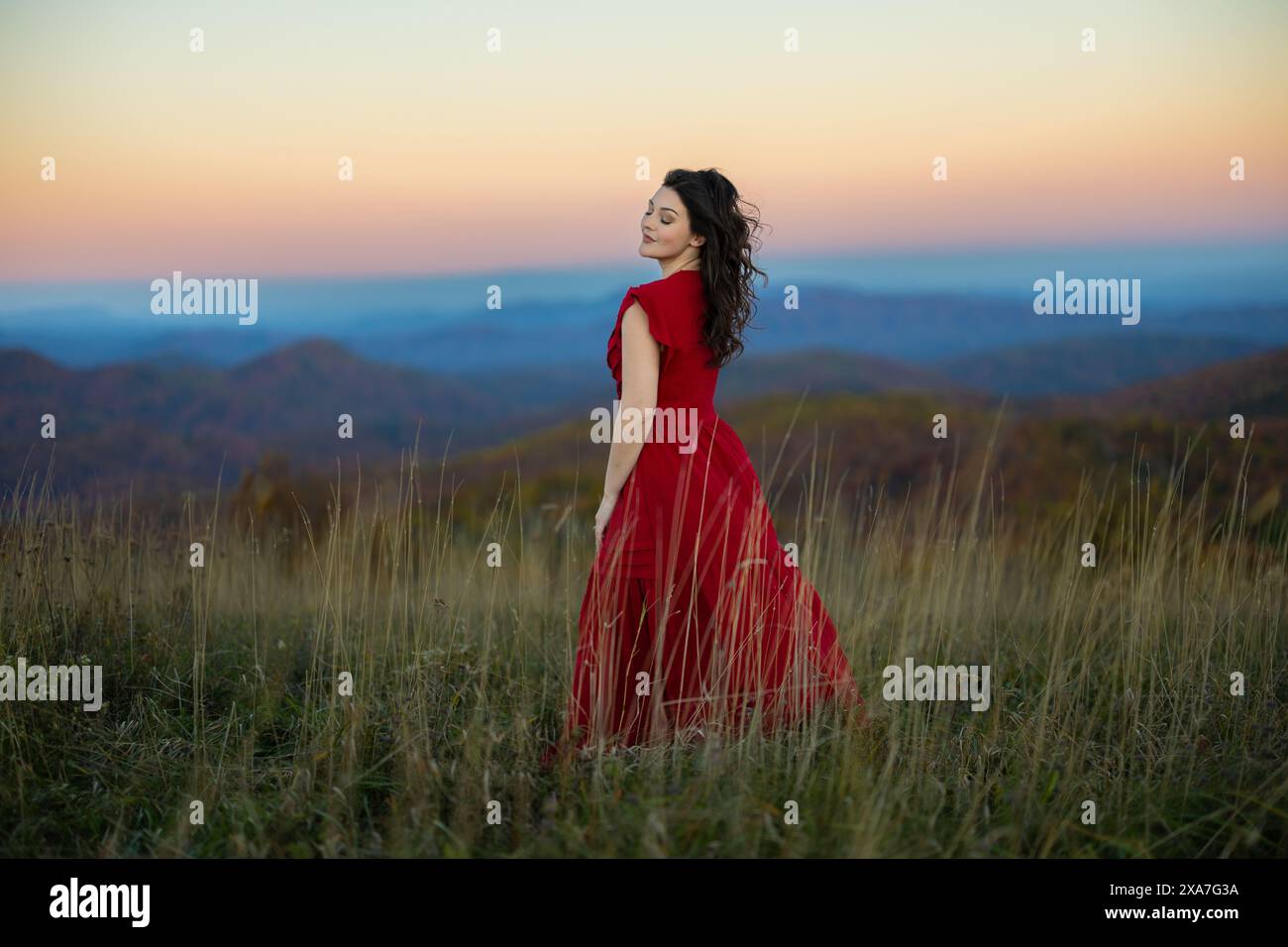 Woman standing contemplating in nature hi-res stock photography and ...