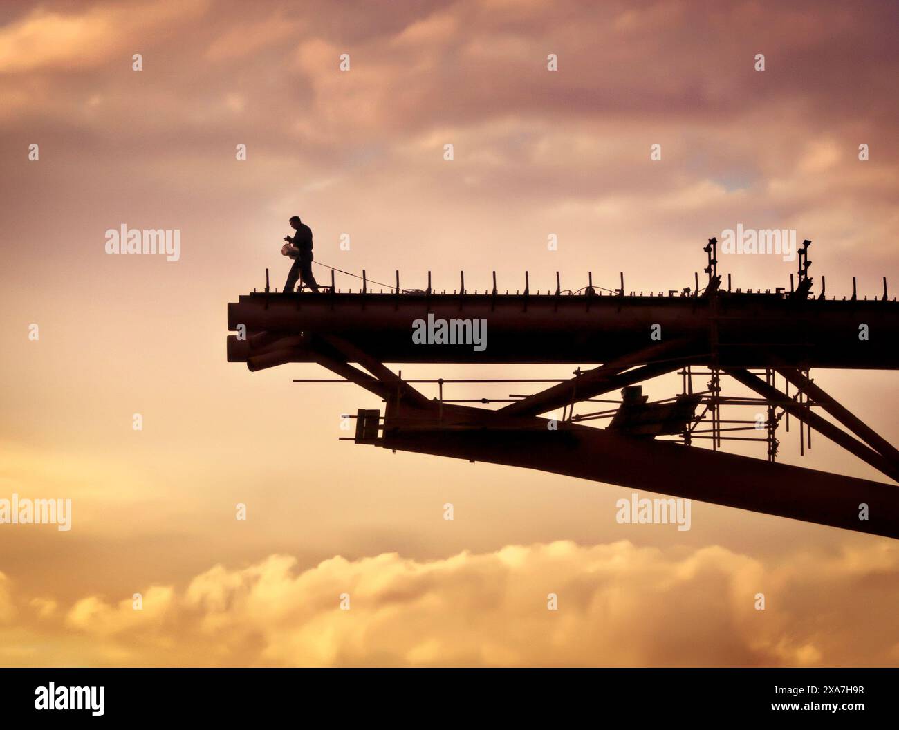Man standing bridge sunset hi-res stock photography and images - Alamy