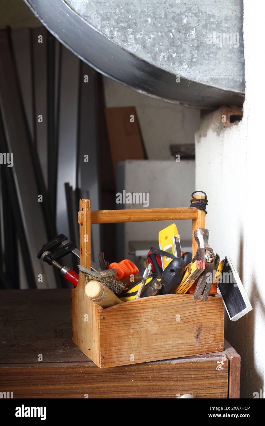 wooden toolbox with tools at work place Stock Photo - Alamy